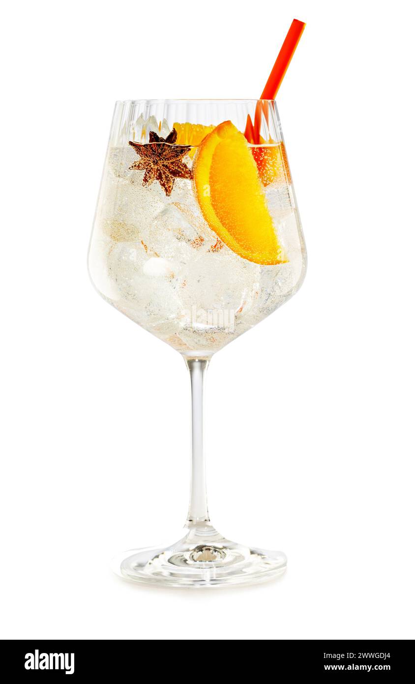 Crystal balloon glass of vodka tonic garnished with star anise and ...