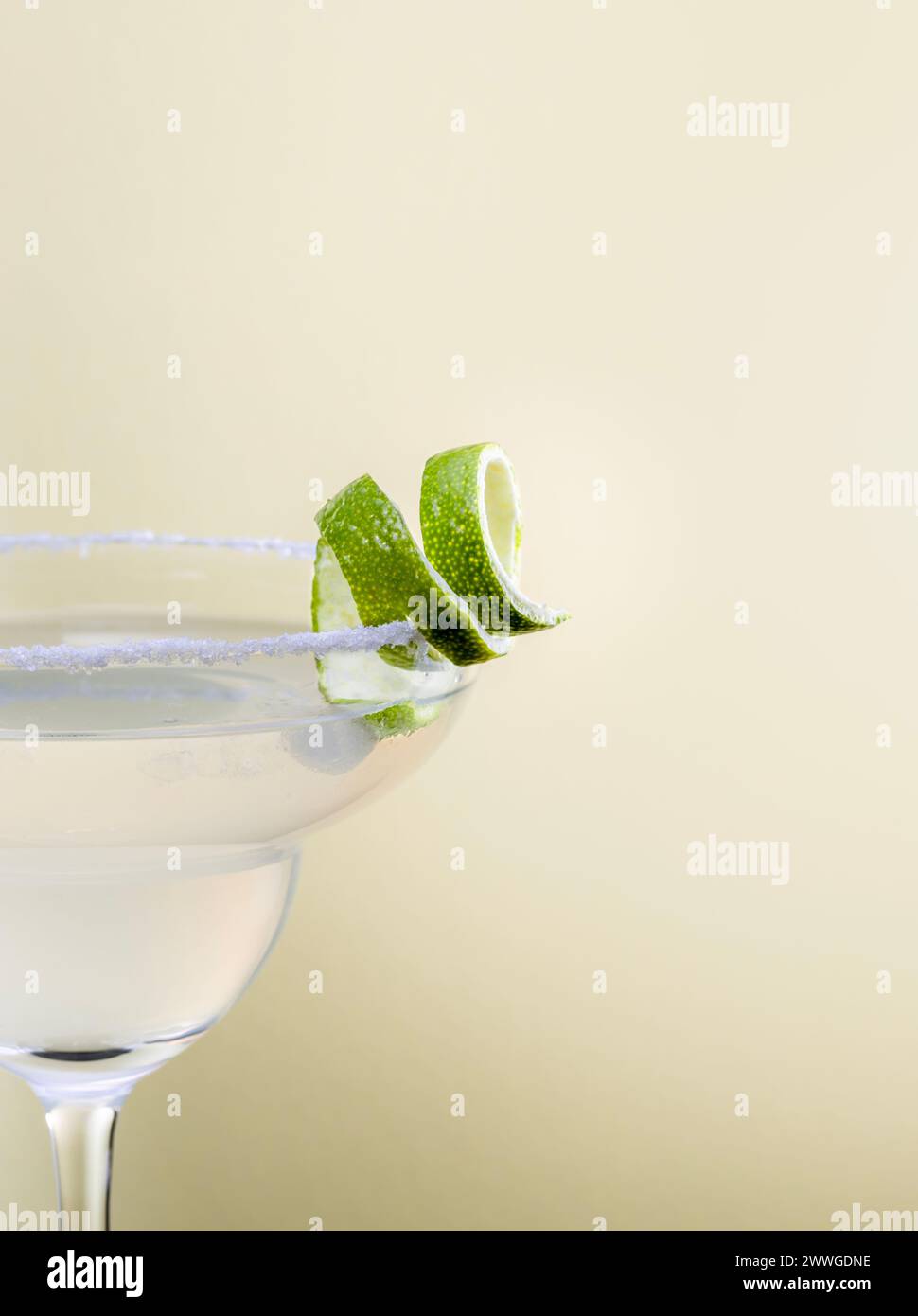 Close up of lime zest on salt rim of margarita cup glass isolated on ...
