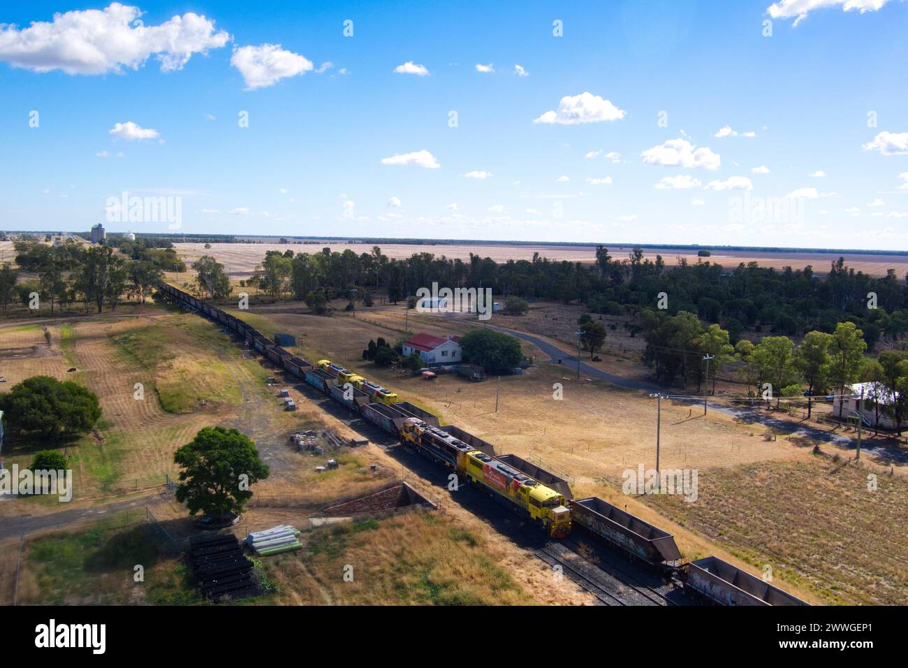 Aerial of Coal Trains passing through Warra on the Darling Downs ...