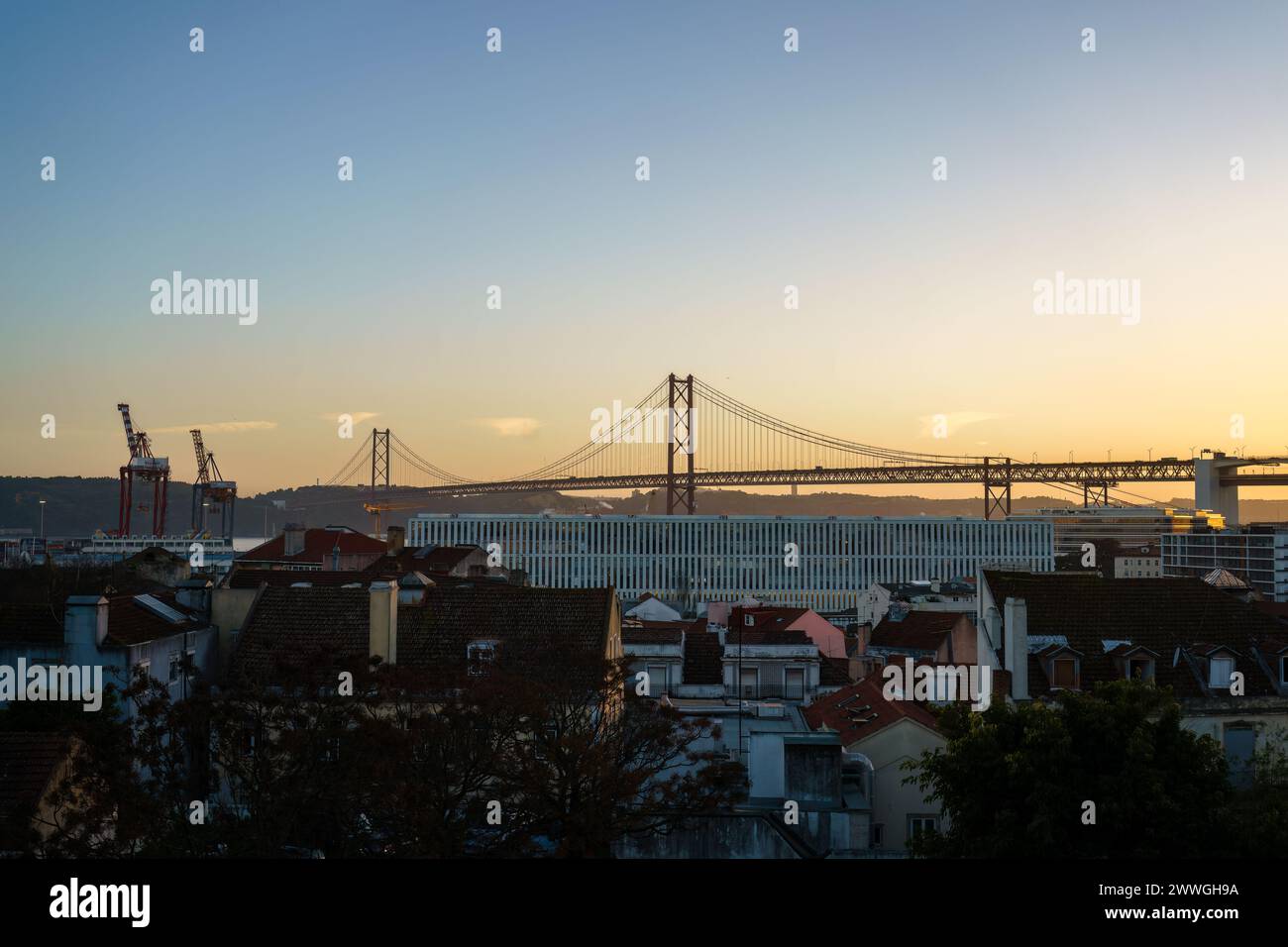 Sunset Over the 25 De Abril Bridge and Harbor in Lisbon, Portugal ...