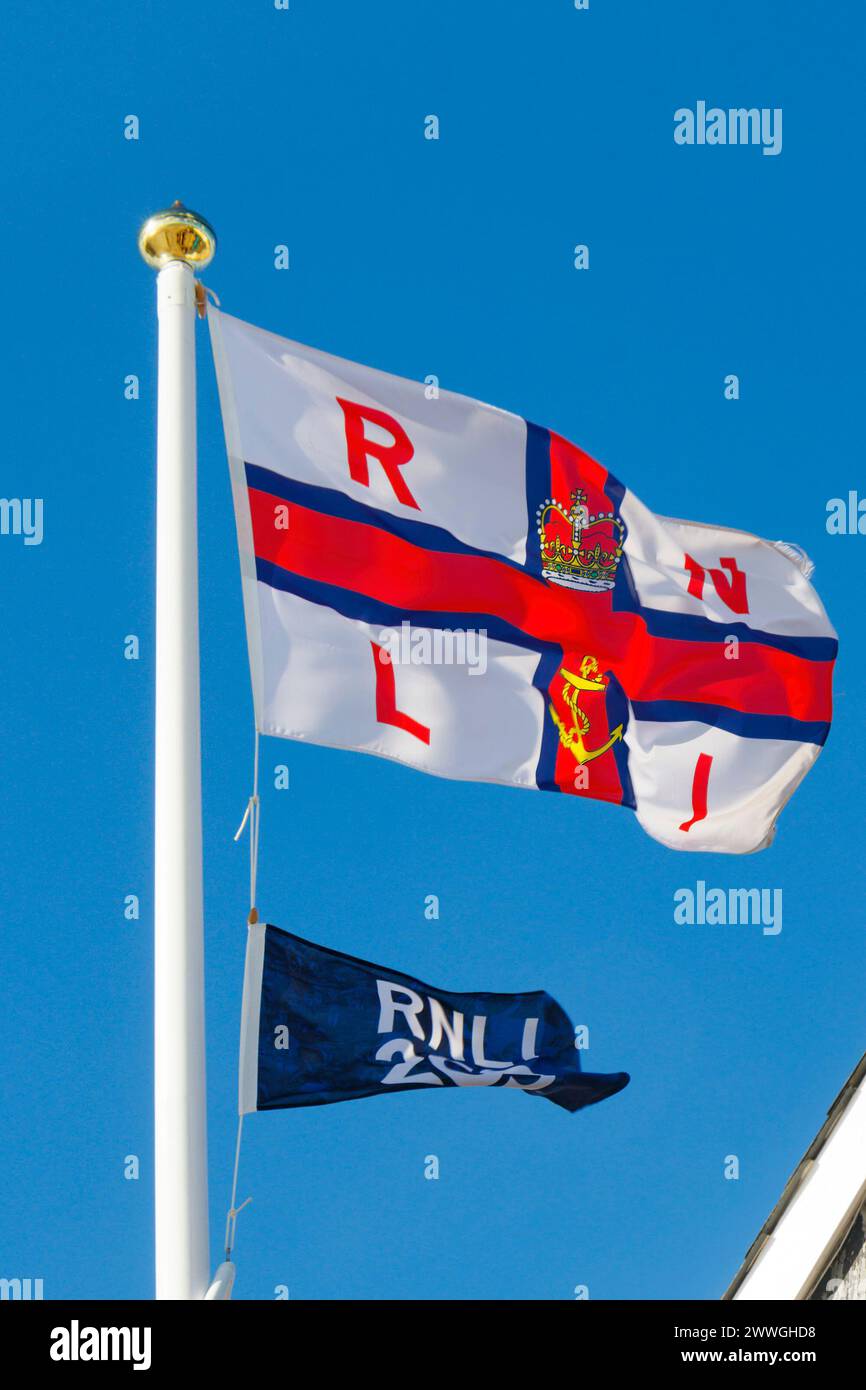 RNLI flag blowing in the wind lifeboat rescue station Newbiggin by Sea ...