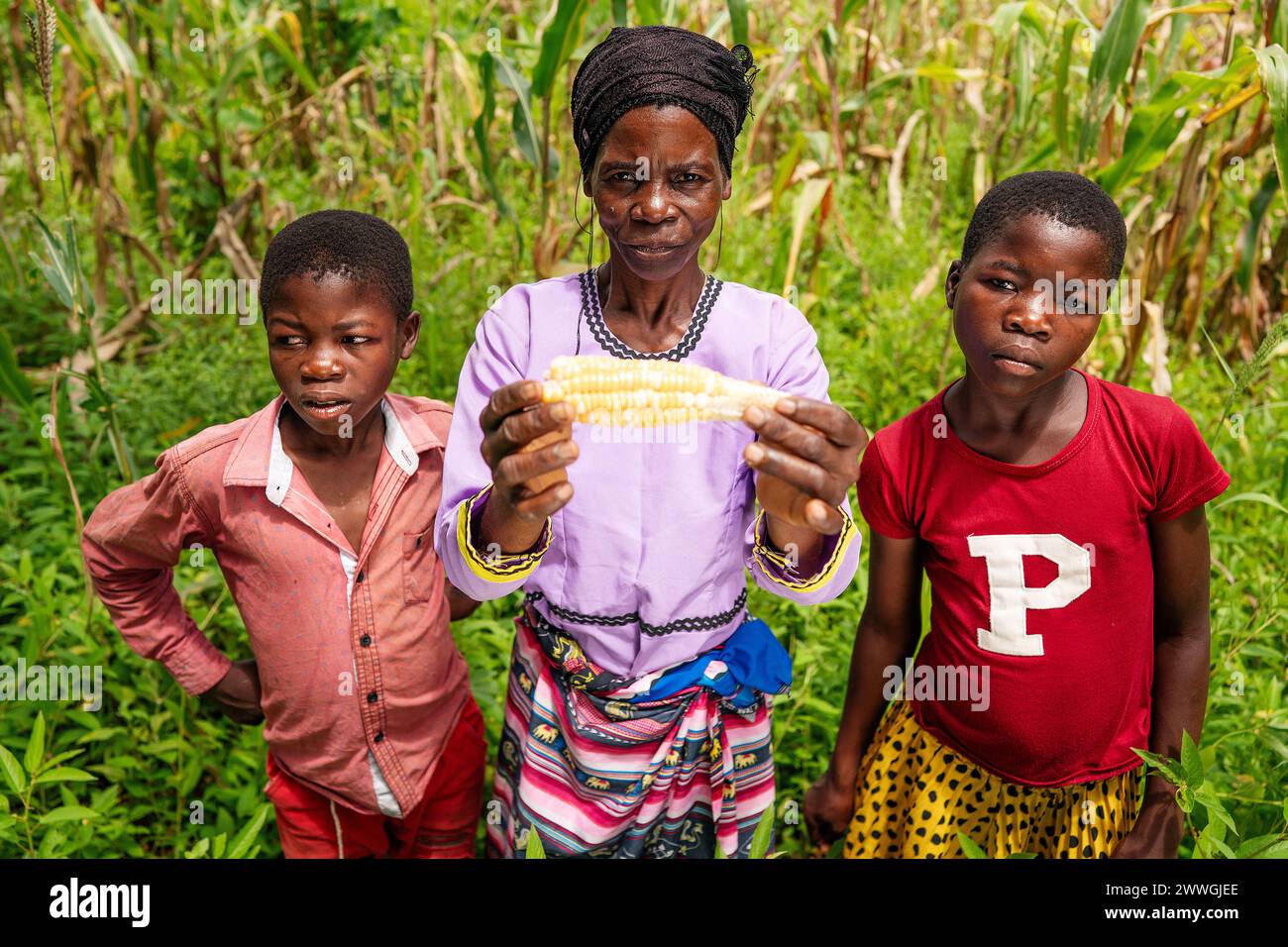 Malita Mussa and her thirteen-year-old twins Patrick (left) and Patricia who appear on this year ...
