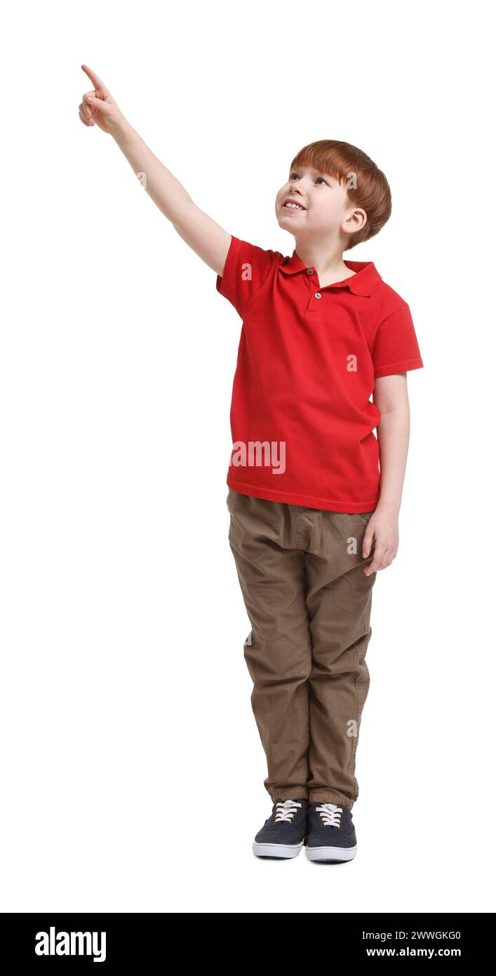 Little boy pointing at something on white background Stock Photo - Alamy