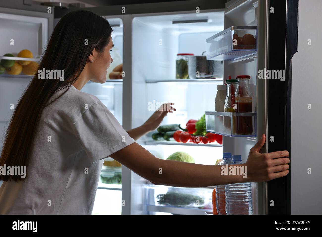 Back view woman looking night hi-res stock photography and images - Alamy