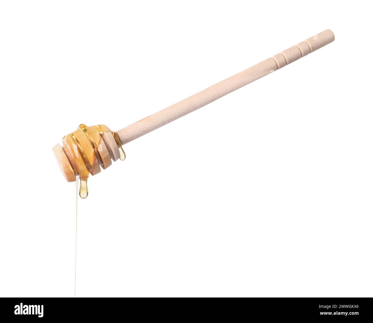 Fresh honey dripping from dipper on white background Stock Photo - Alamy