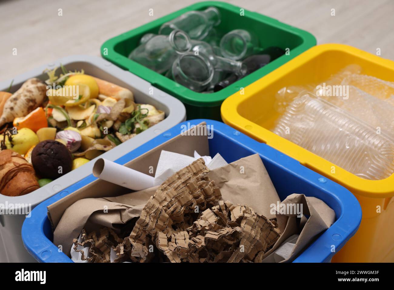 Garbage sorting. Full trash bins for separate waste collection indoors ...