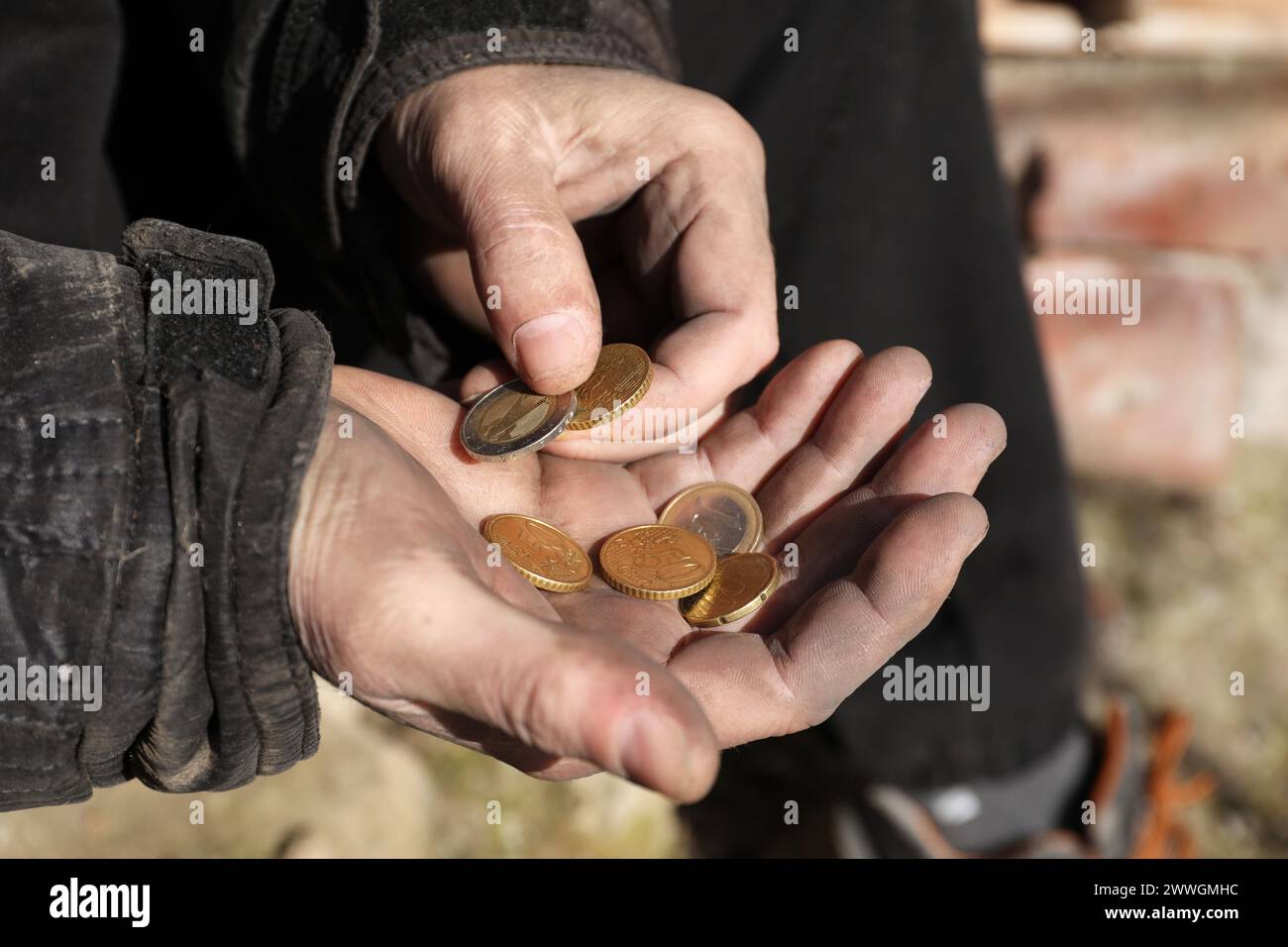 Homeless man counting money hi-res stock photography and images - Alamy