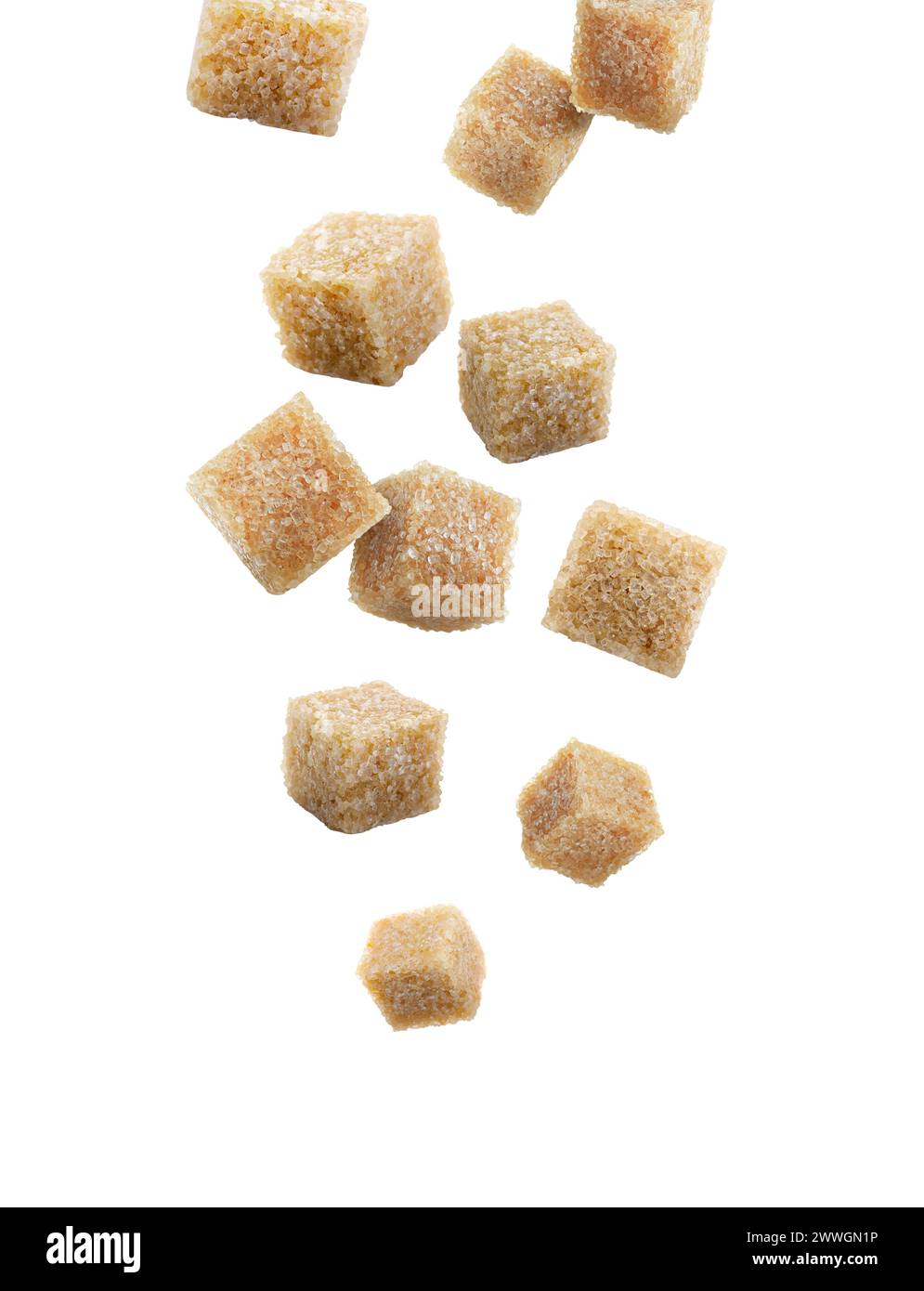 Brown cane sugar cubes falling on white background Stock Photo - Alamy