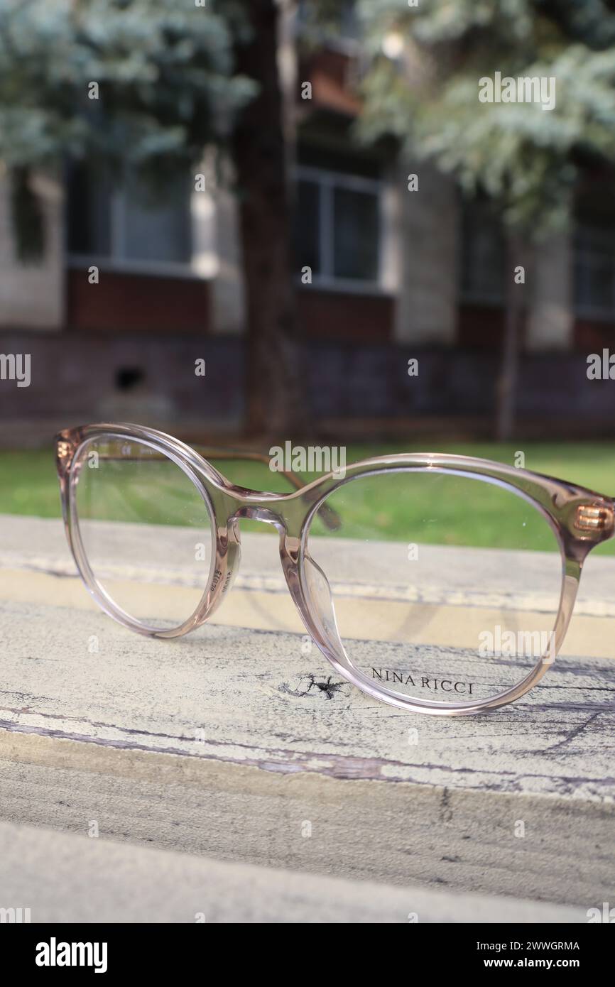 Vision care accessory eyeglasses with wooden rim hanging on window sill ...