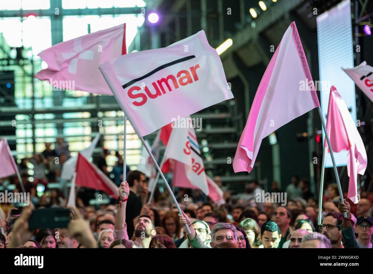 Madrid, Spain. 23rd Mar, 2024. Supporters of Sumar wave flags during ...