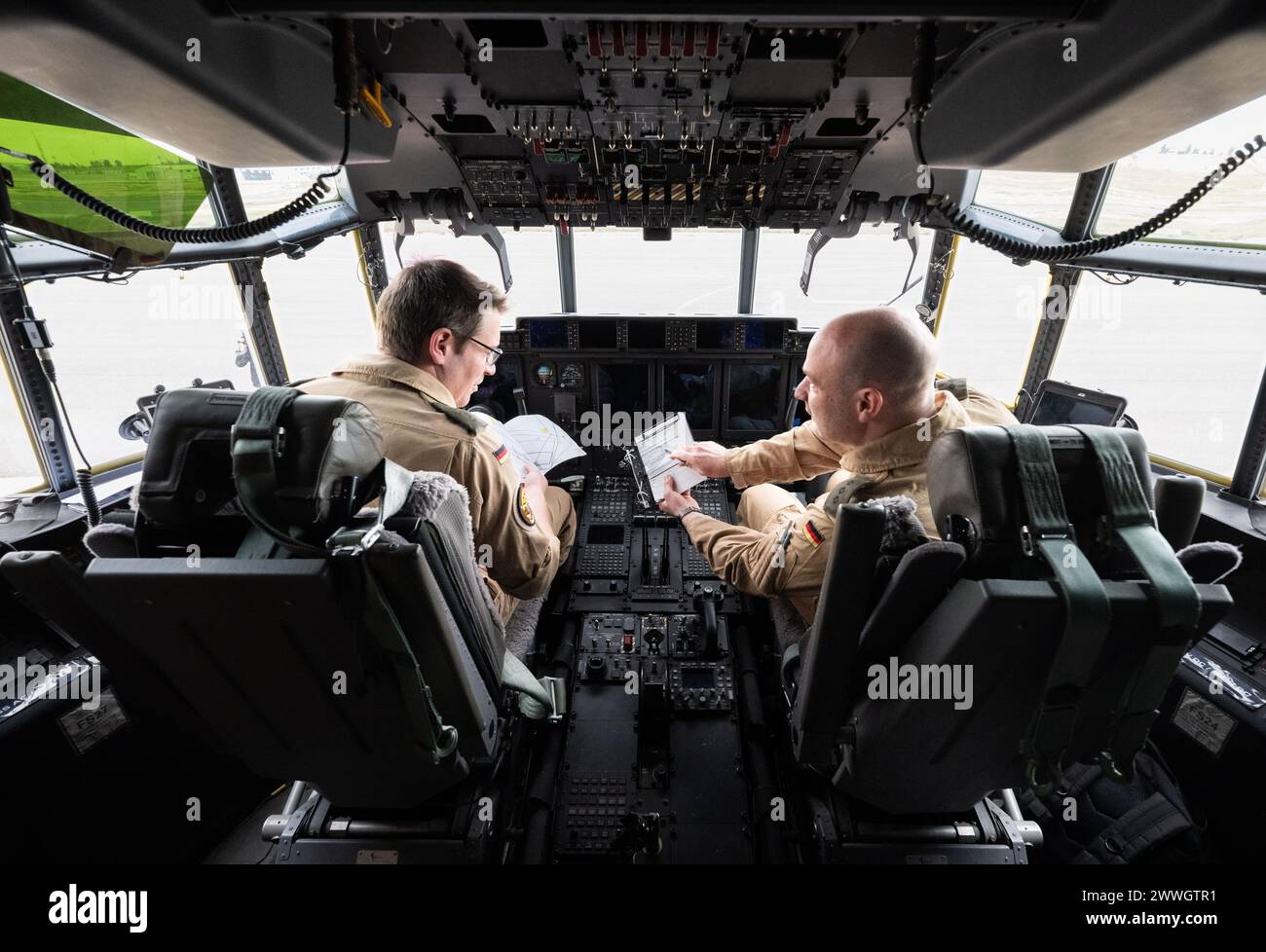Amman, Jordan. 24th Mar, 2024. Pilots discuss details of the flight in ...