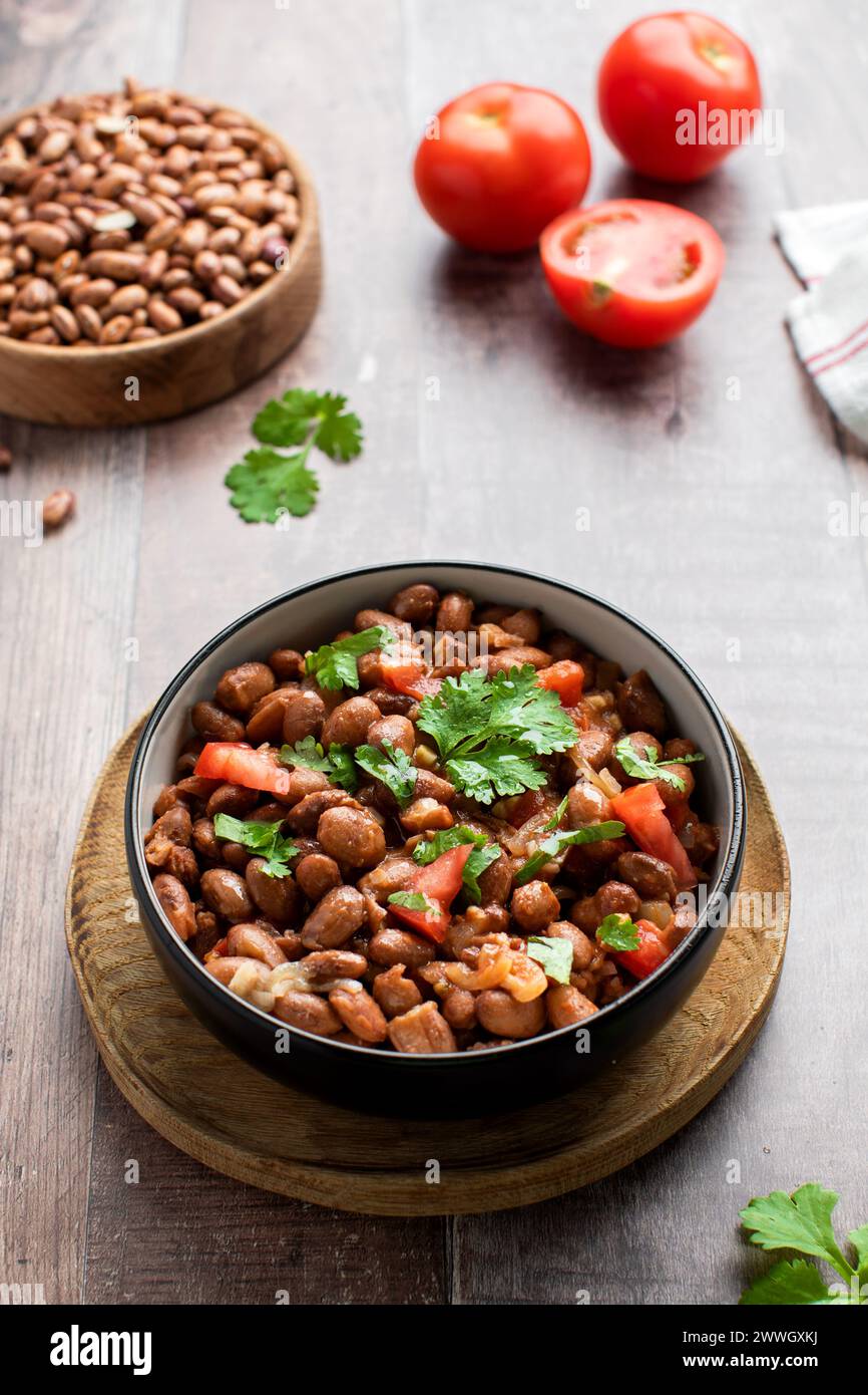 Vegetarian dish of stewed pink beans and tomatoes. A delicious bean ...