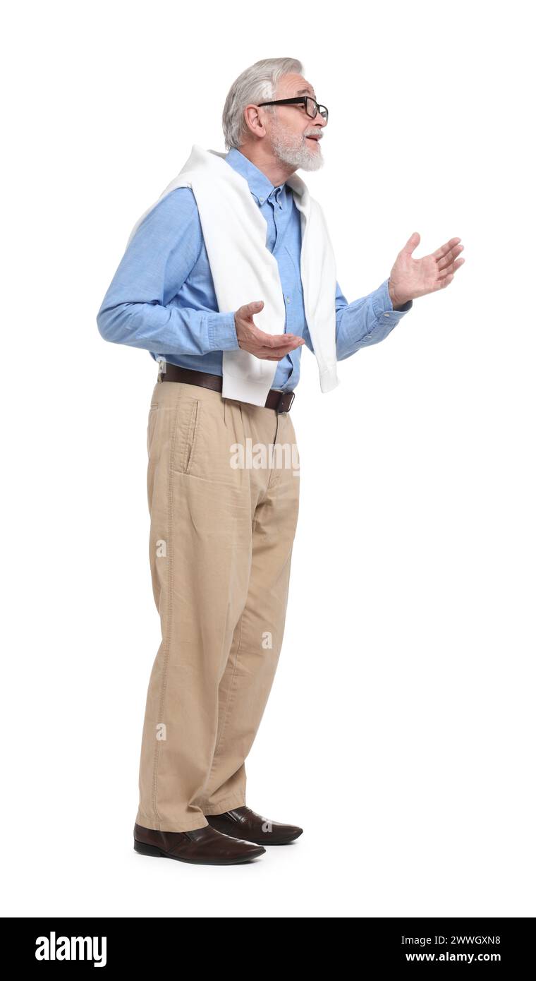 Senior man greeting someone on white background Stock Photo - Alamy