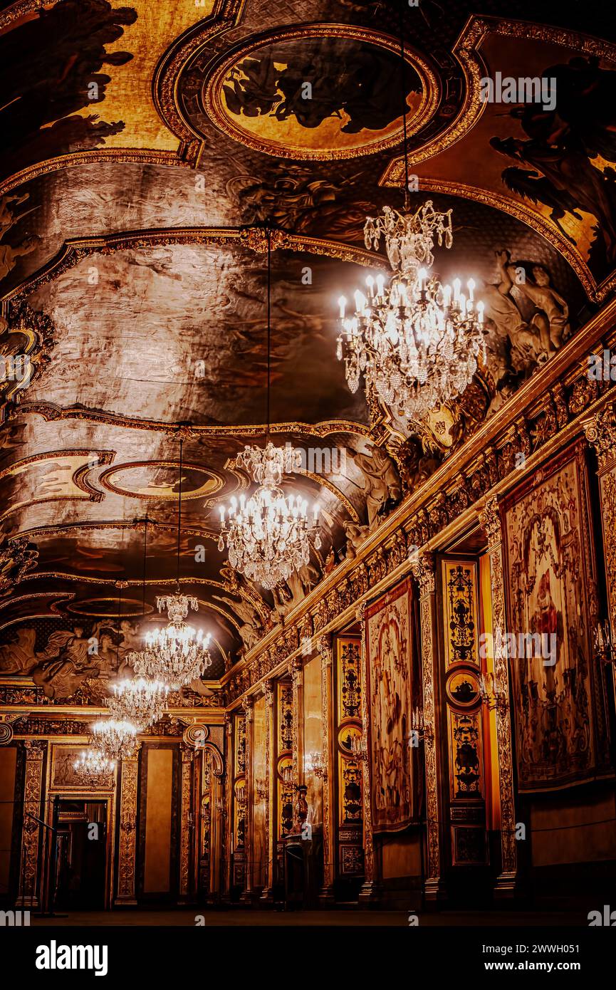 An opulent opera hall adorned with chandeliers and murals Stock Photo ...