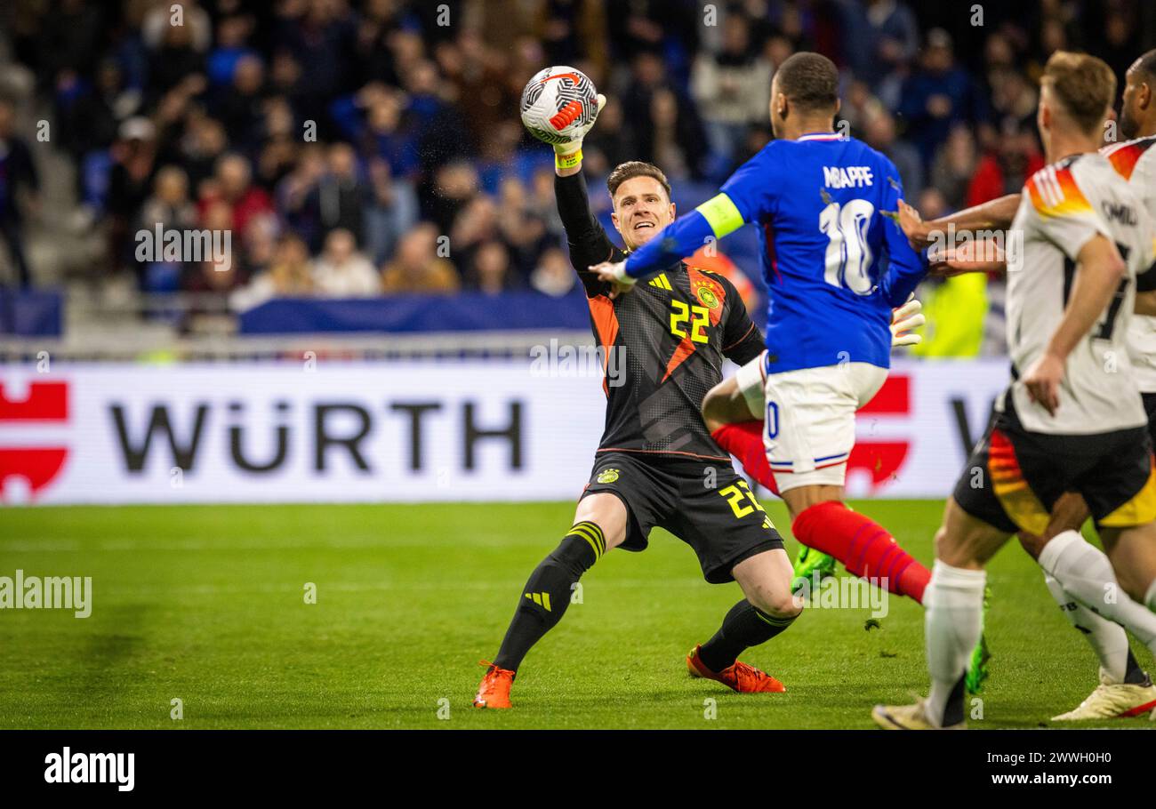 Lyon, France. 23rd Mar 2024. Abwehr von Torwart Marc-Andre ter Stegen ...