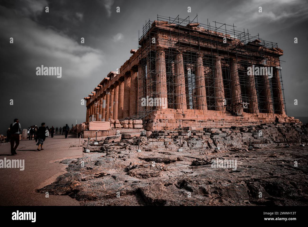 The ancient Parthenon stands under moody skies, its grandeur ...