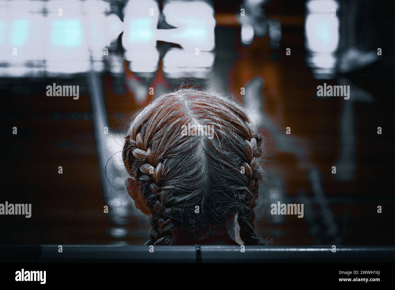 The back of a child's head, gazing out, a silent observer to the world ...