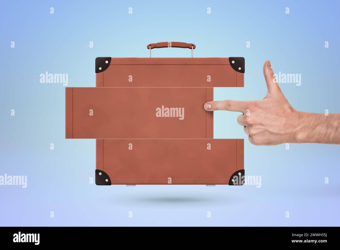 Leather suitcase with pointing hand Stock Photo - Alamy