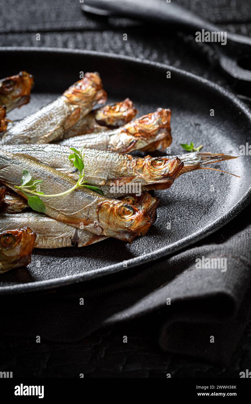 Tasty and salty smoked sprats made in a home smokehouse. Smoked fish ...