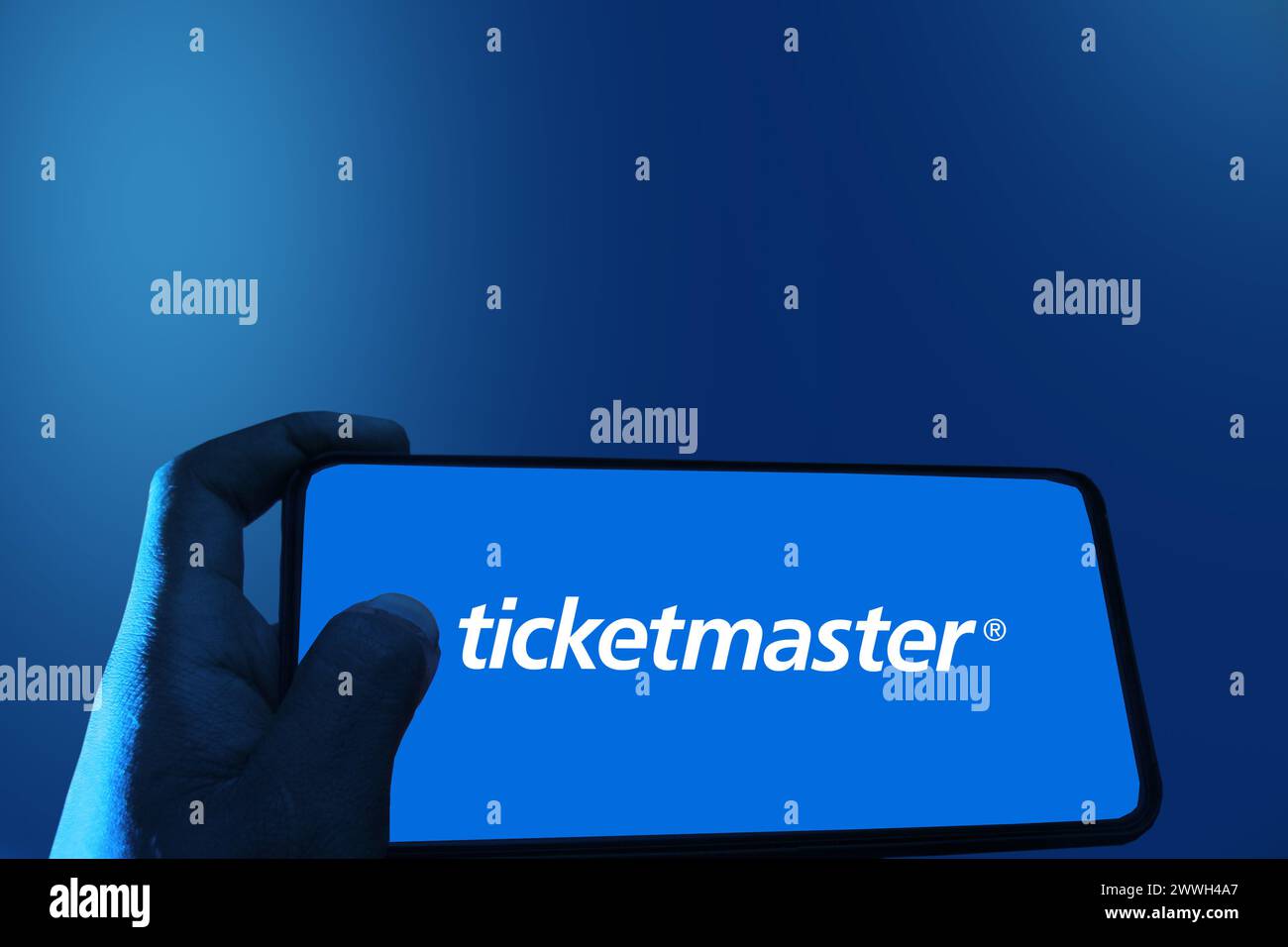 Hands close up. This photo illustration features the US company logo ...