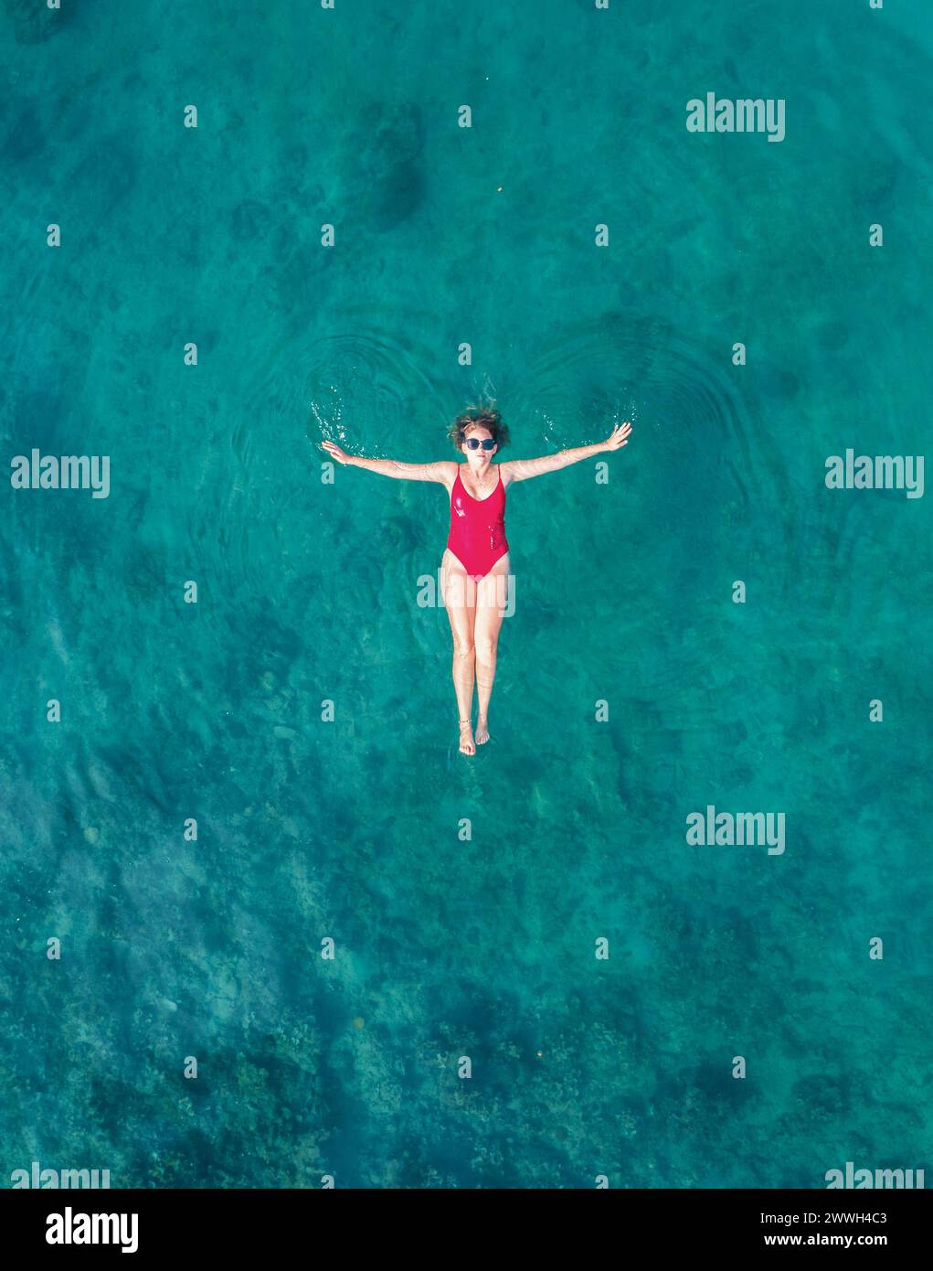 Aerial view of a woman swimming in ocean hi-res stock photography and ...