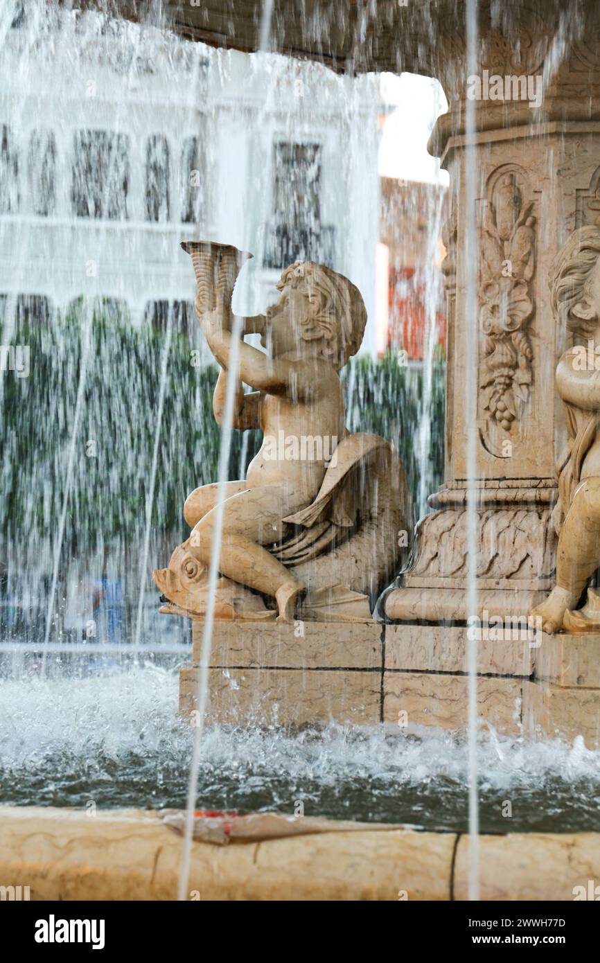 Baroque marble fountain in the main square of Merida, called Plaza de ...
