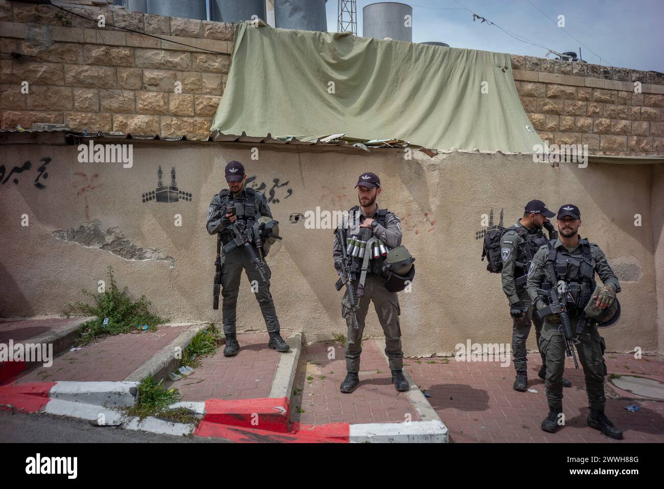 Hebron, Palestinian Territories. 24th Mar, 2024. Israeli soldiers stand ...