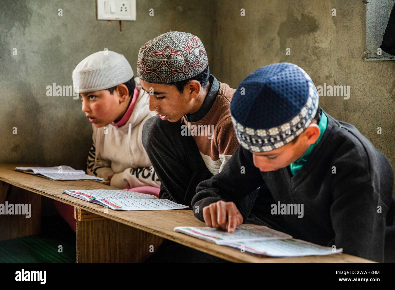 Muslim students read the Quran at an Islamic school or madrasa in ...