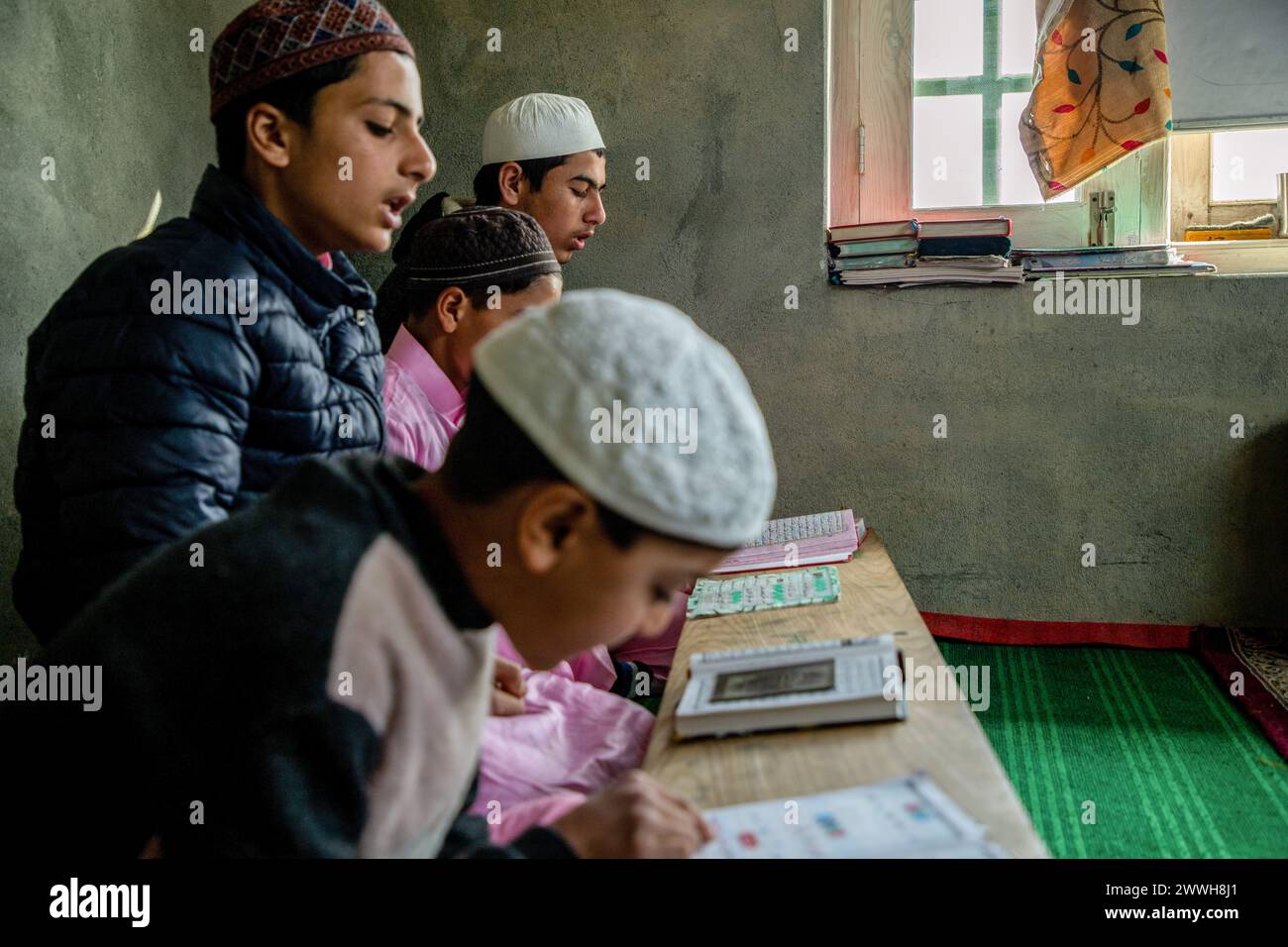 Muslim students read the Quran at an Islamic school or madrasa in ...