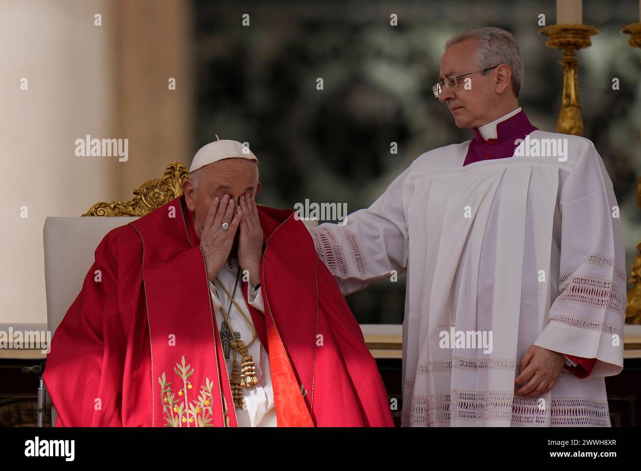 Pope Francis rubs his eyes before the start of the Palm Sunday mass in ...