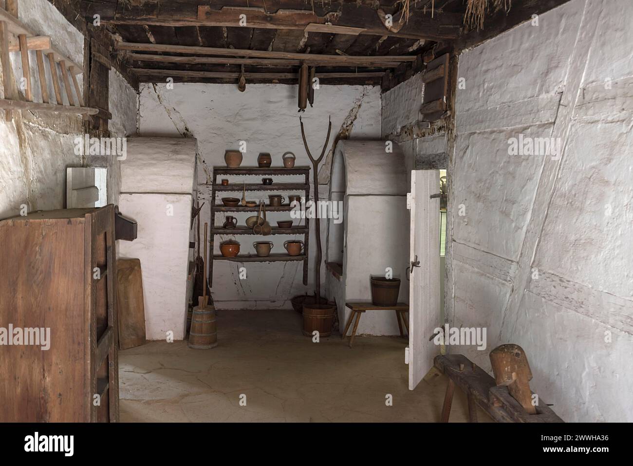 Kitchen with two hobs in a historic farmhouse from the 19th century ...