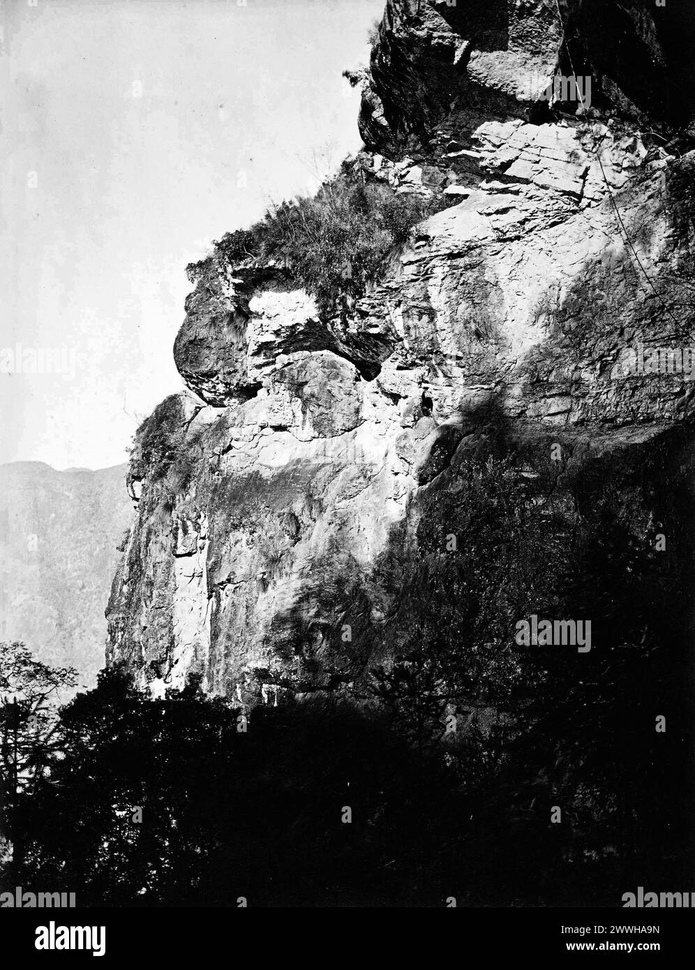 Left shoulder of the cave in which is situated Yuen-foo Monastery Stock ...