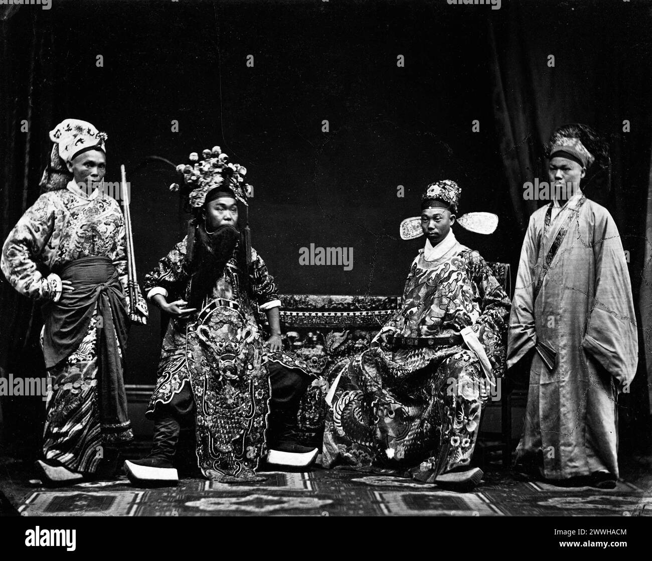 Four Chinese men in costume Stock Photo - Alamy