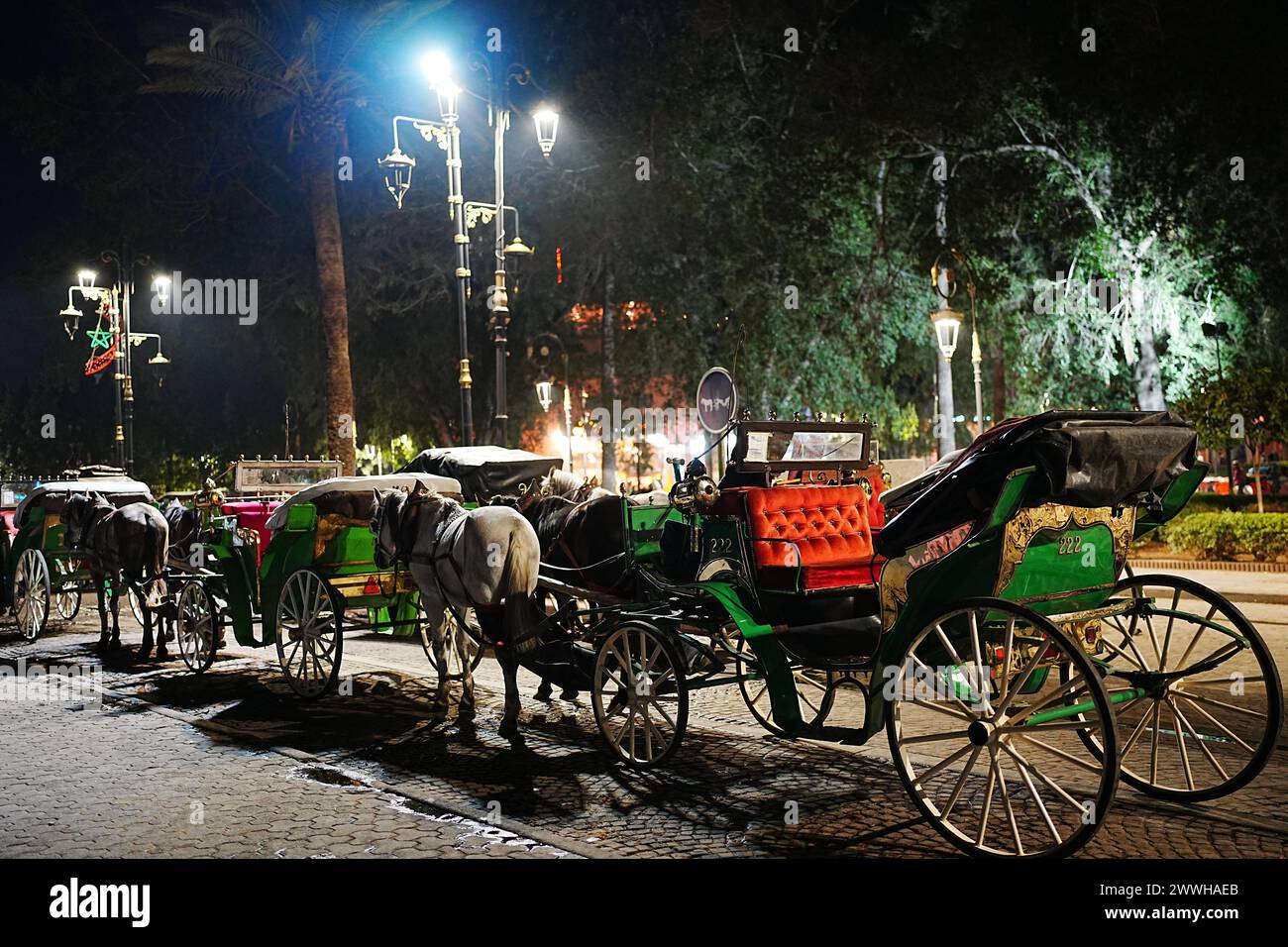 Horse-drawn carriages at Jemaa el-Fnaa in African MARRAKESH city in ...