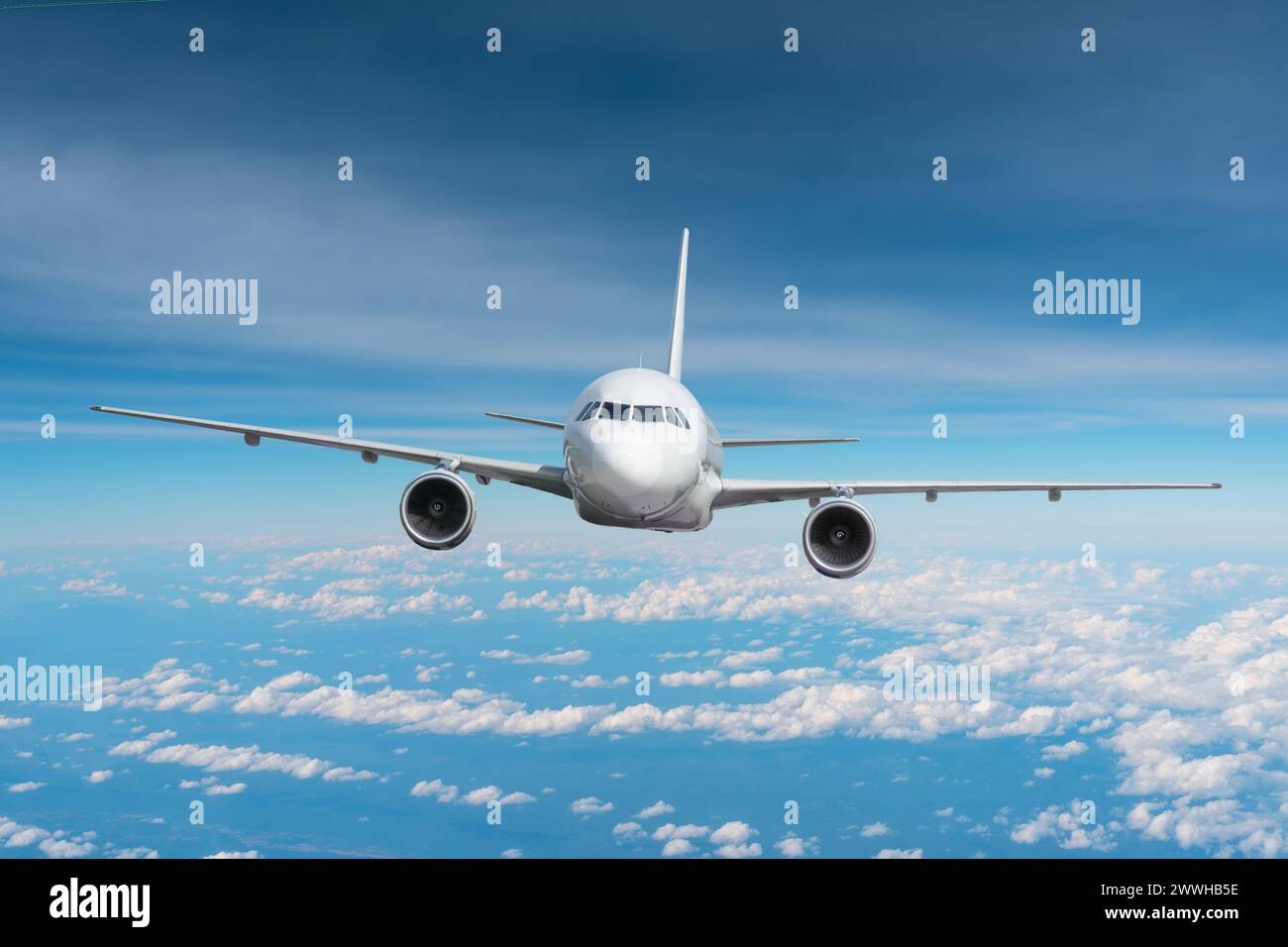 Passenger civil airplane jet flying at flight level high in the sky ...