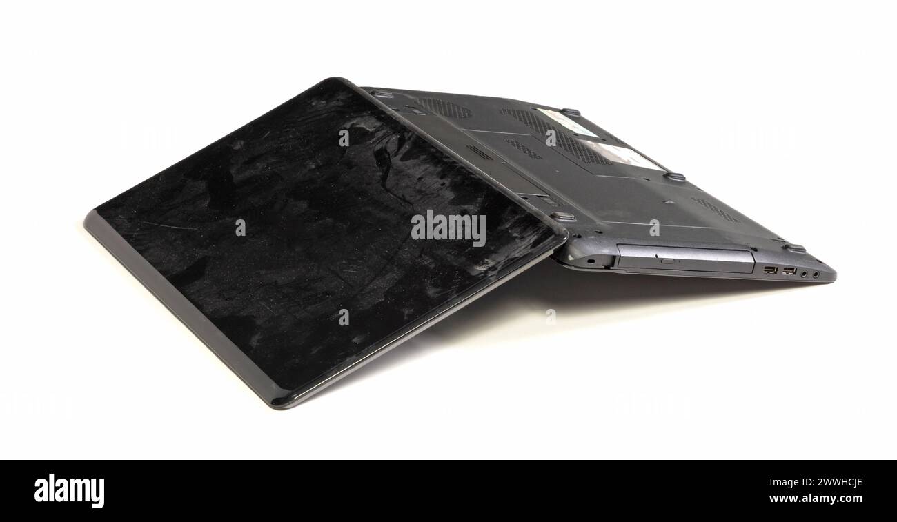 Old broken laptop isolated on white a background Stock Photo - Alamy
