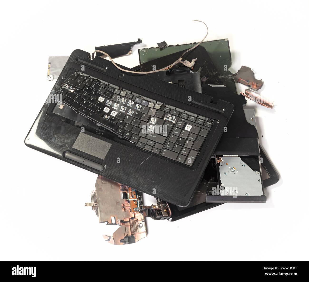 Old broken laptop isolated on white a background Stock Photo - Alamy