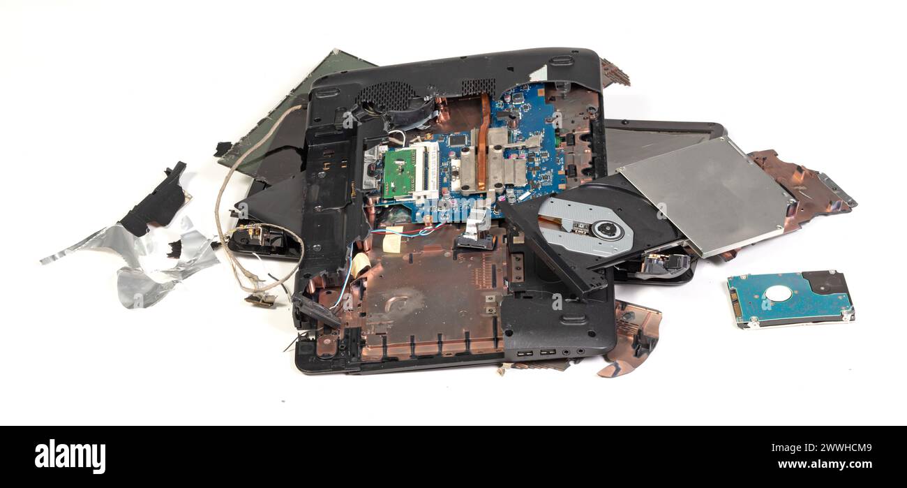 Old broken laptop isolated on white a background Stock Photo - Alamy