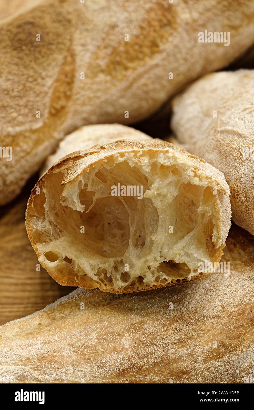 Pieces of baguette, traditional long French wheat bread, abstract food ...