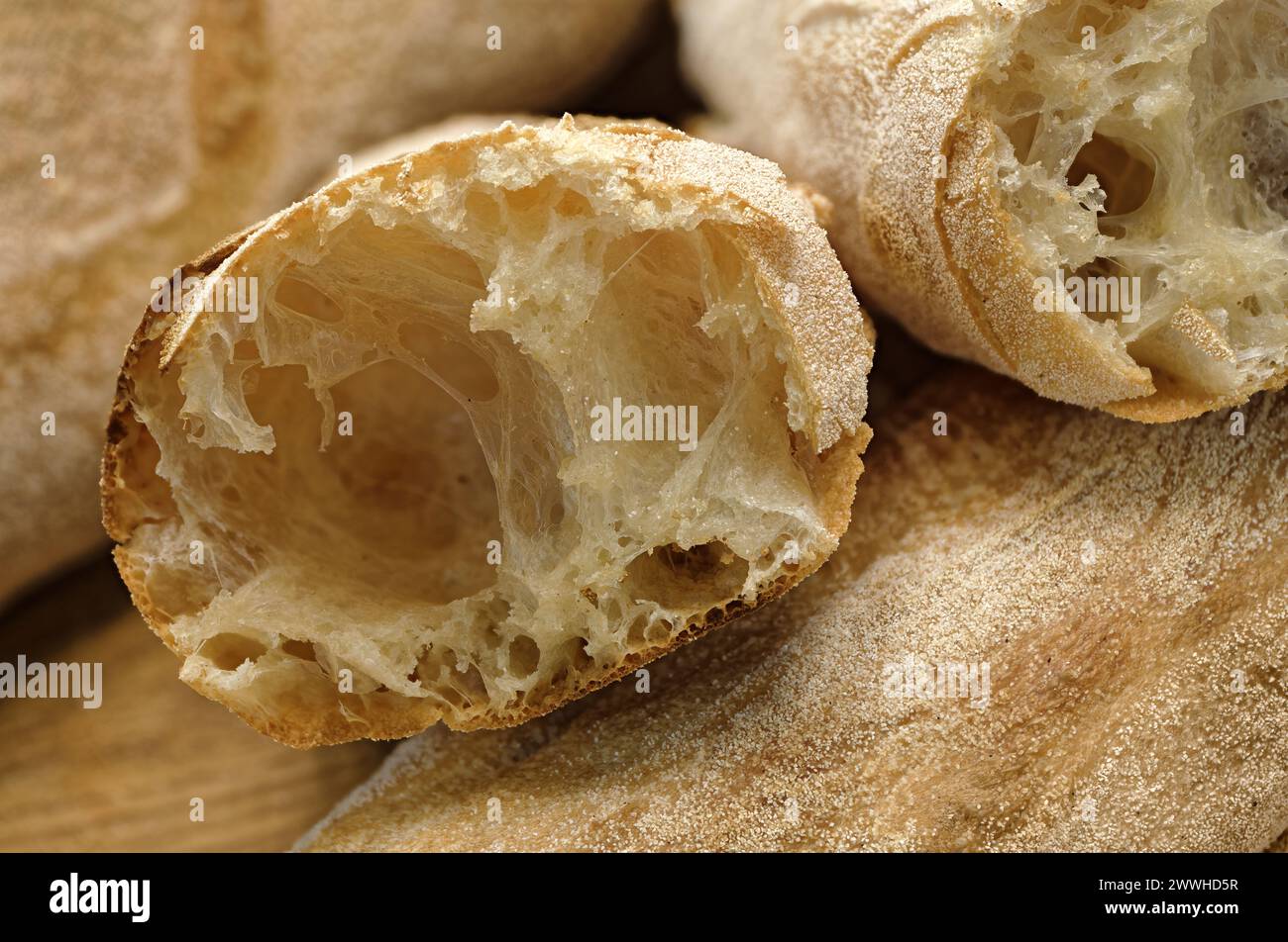 Pieces of baguette, traditional long French wheat bread, abstract food ...