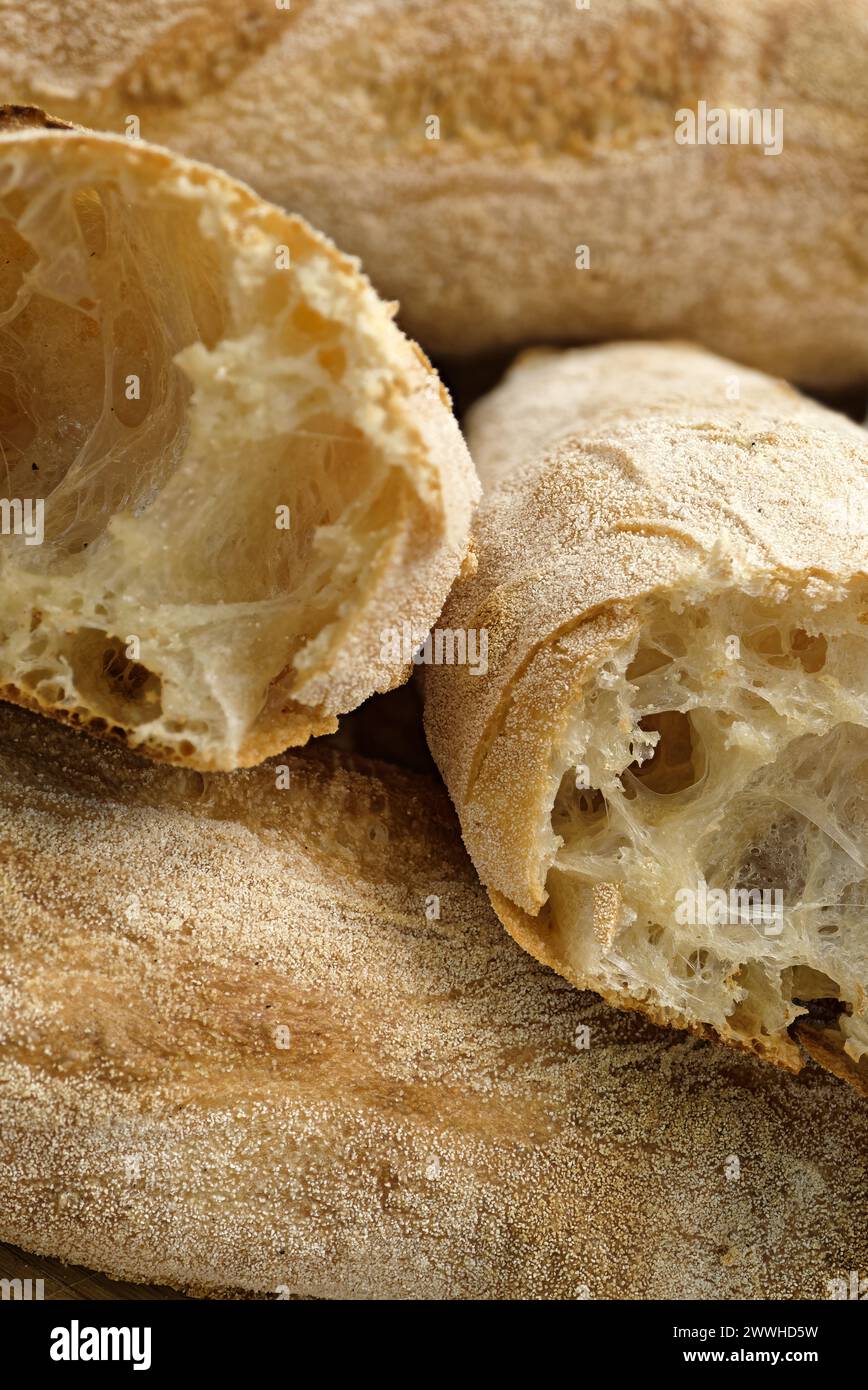 Pieces of baguette, traditional long French wheat bread, abstract food ...