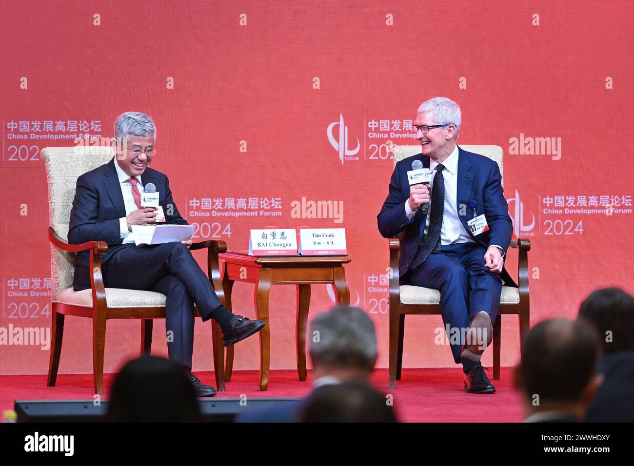 Beijing, China. 24th Mar, 2024. Apple CEO Tim Cook (R) talks with Bai ...