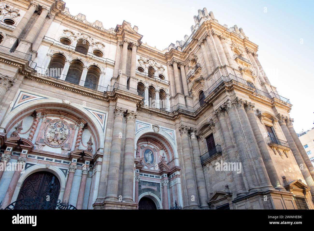 The Cathedral of Malaga front view from below with blue sky in the ...