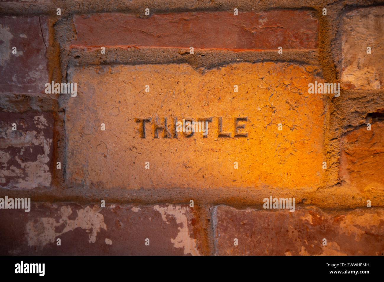 Red brick wall, branded bricks, moulded Stock Photo - Alamy