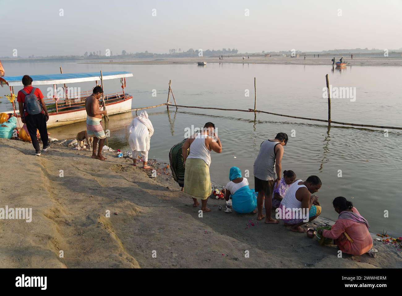 People performing rituals before the Holi at the Ganges. Sarsaiya Ghat ...
