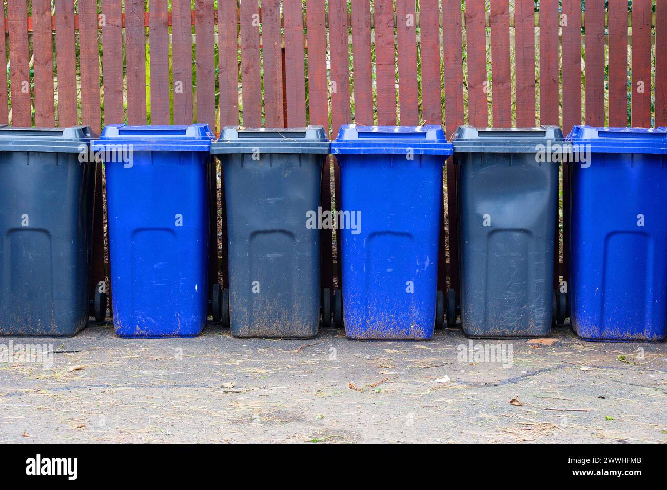 Wheelie bins in row for refuge collection outside council residential ...