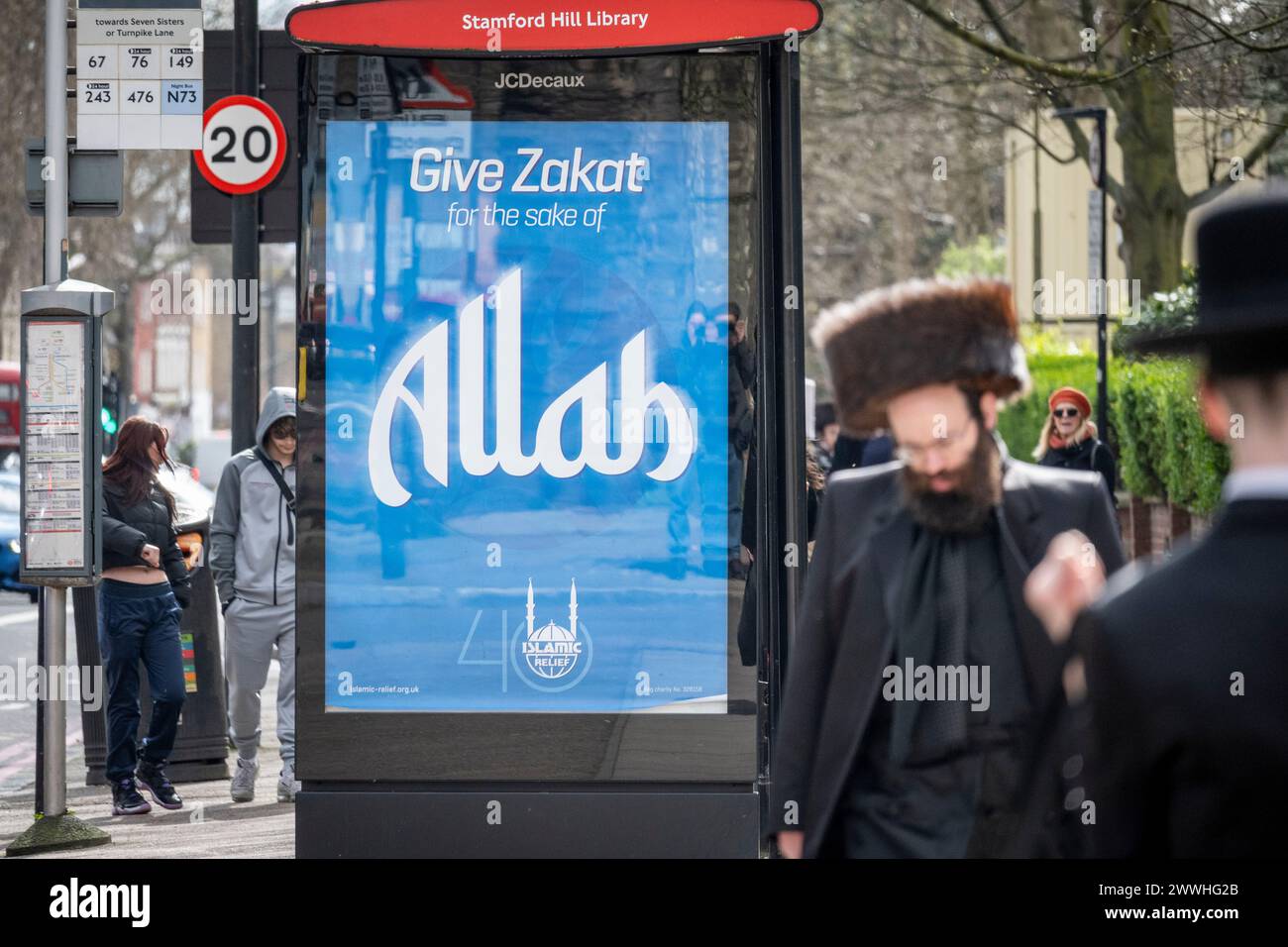 London, UK. 24 March 2024. An Allah sign on a bus stop on the high ...