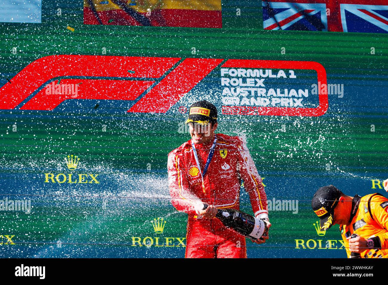 Melbourne, Australia. 24th Mar, 2024. Carlos Sainz of Spain (L) and ...