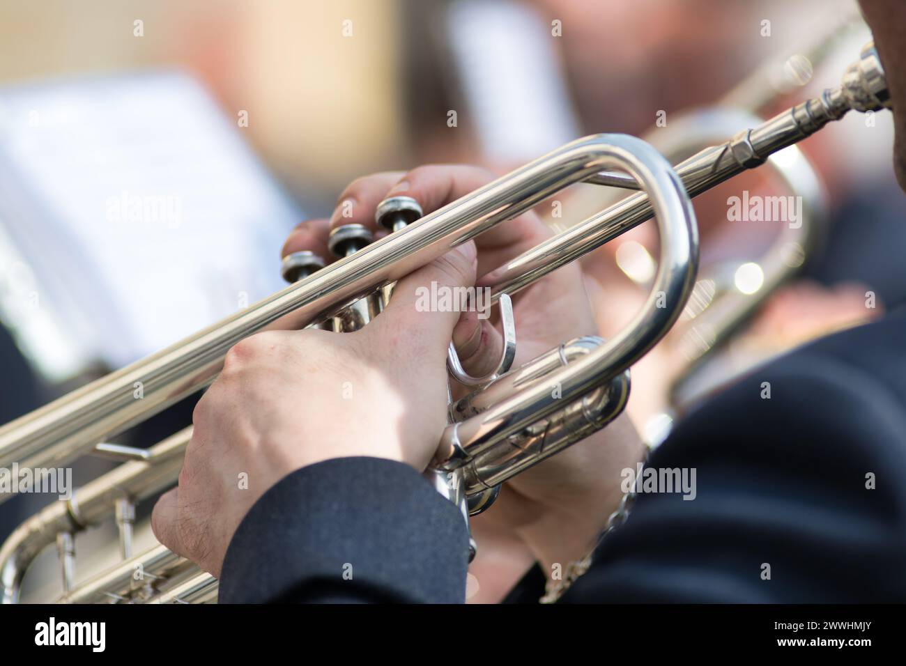 Details of man's hands playing the trumpet during a popular festival in ...