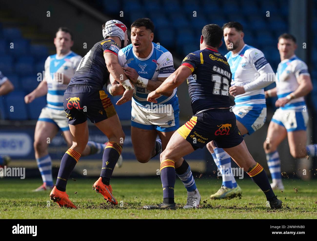 Halifax Panthers' Adam Tangata is tackled by Catalans Dragons' Ben ...
